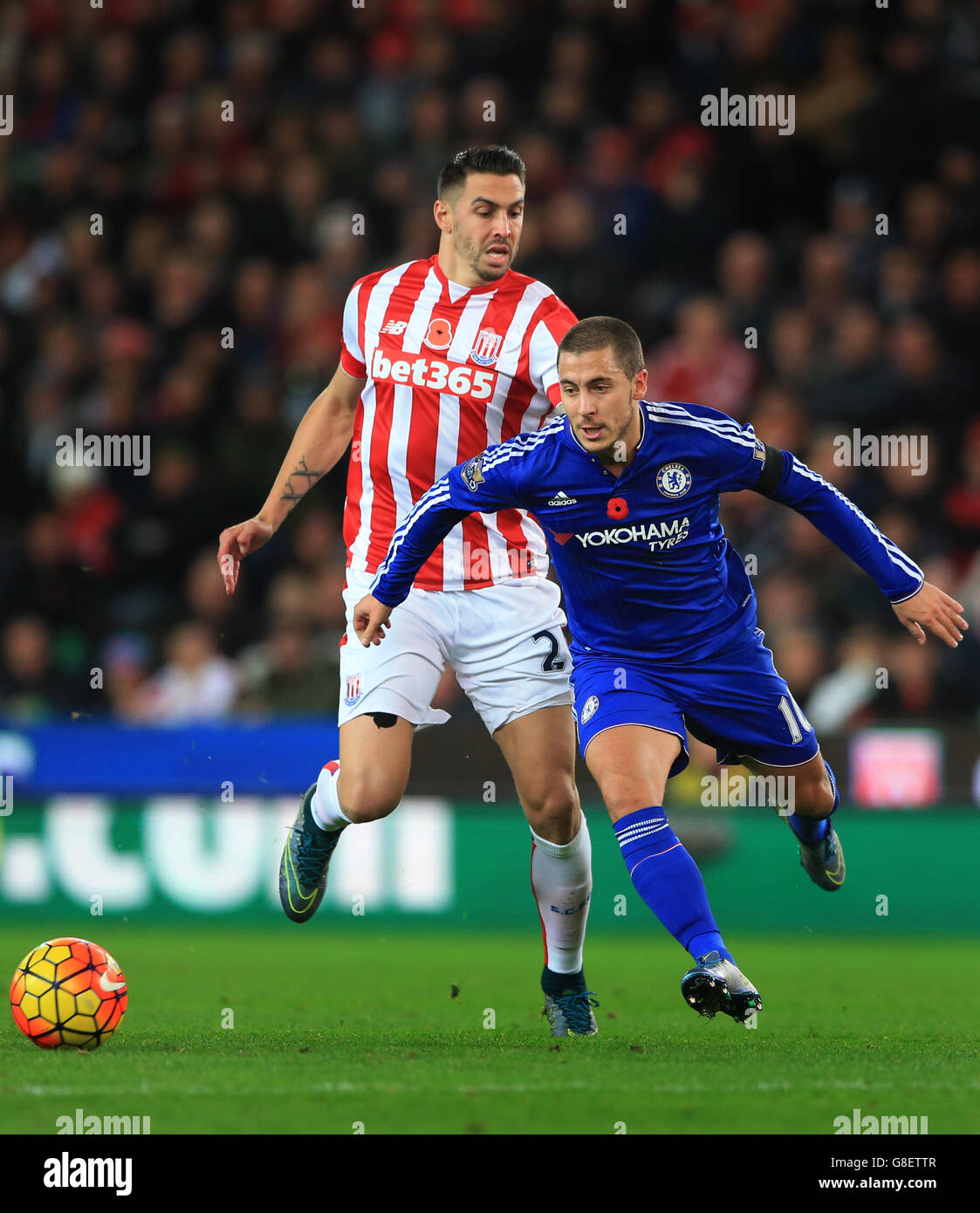 Chelsea's Eden Hazard (right) takes on Stoke City's Geoff Cameron Stock ...