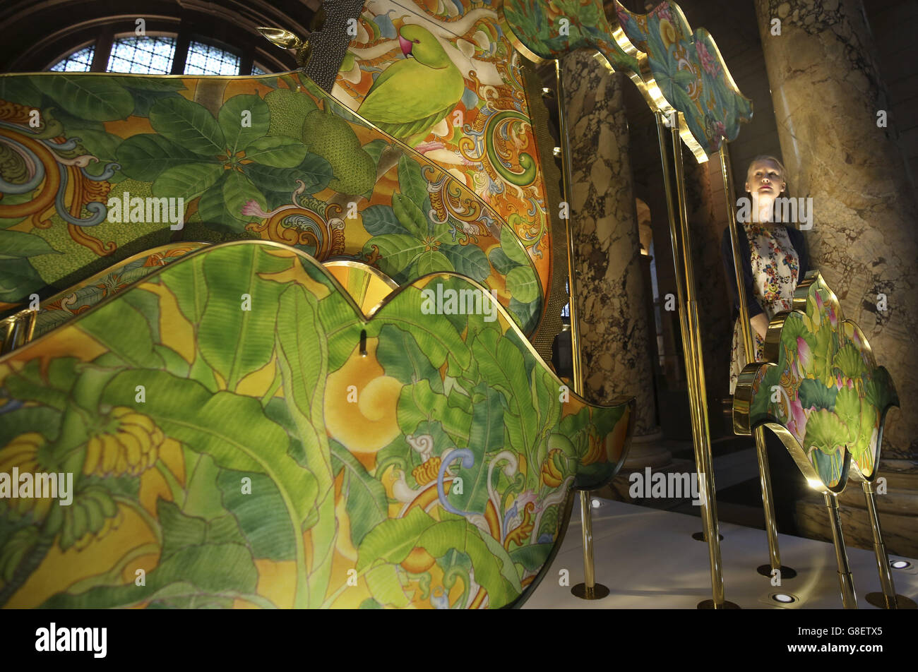 A visitor looks at Kalpataru: The Wishing Tree, a festive light ...