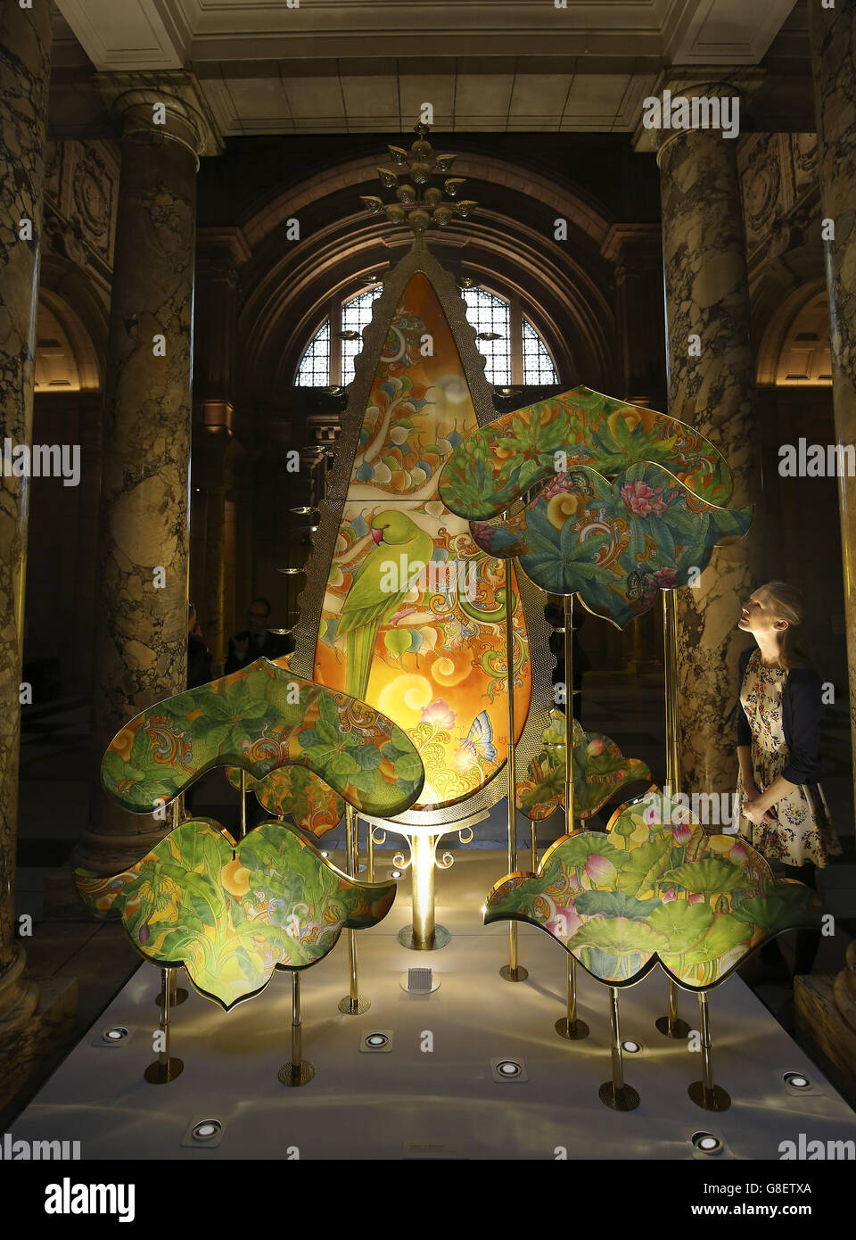 A visitor looks at Kalpataru: The Wishing Tree, a festive light ...