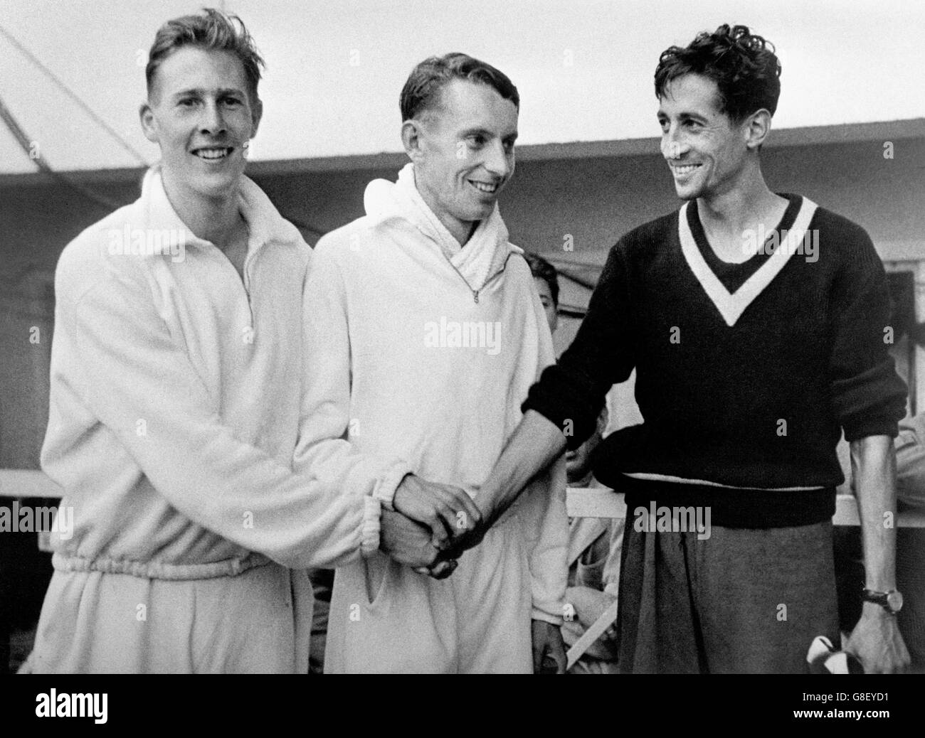 (L-R) Great Britain's Roger Bannister and John Parlett shake hands with ...