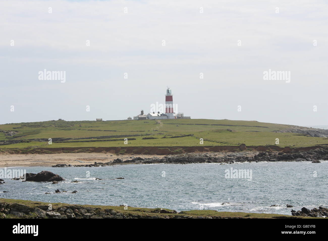 View across to lighthouse on Bardsey Island, North Wales Stock Photo ...