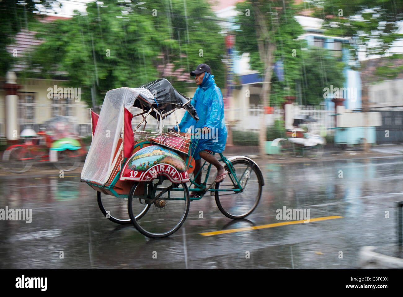 Cycle rickshaw in the rain Stock Photo - Alamy