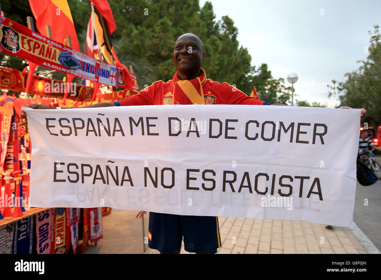 A Spain fan with an anti-racism banner outside the ground before the ...