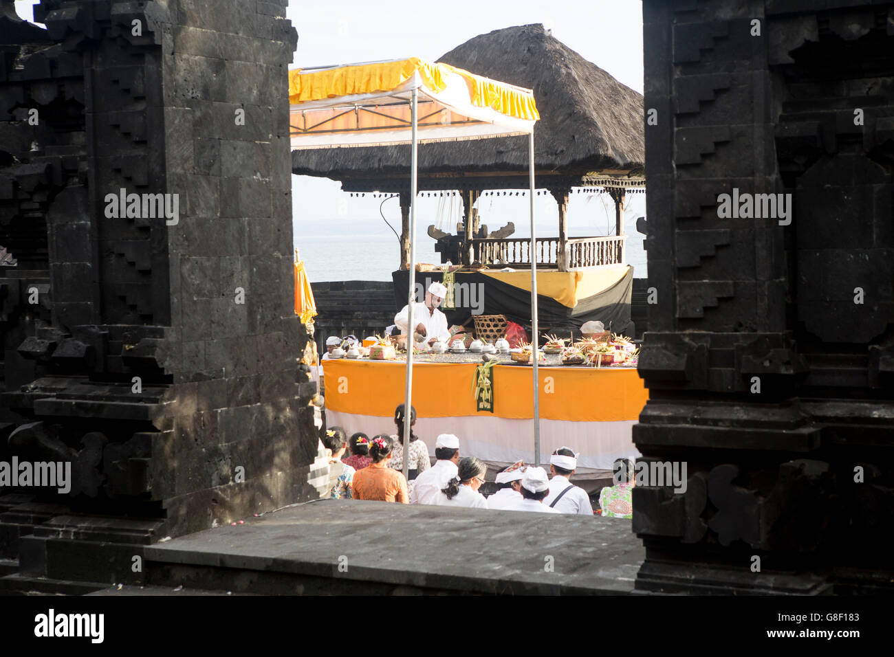 Balinese attending a ritual at a Bali Hindu temple Stock Photo - Alamy