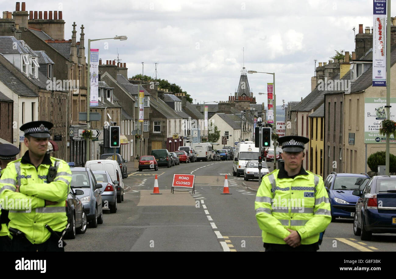 Police block off a section of the main street after a security alert in ...
