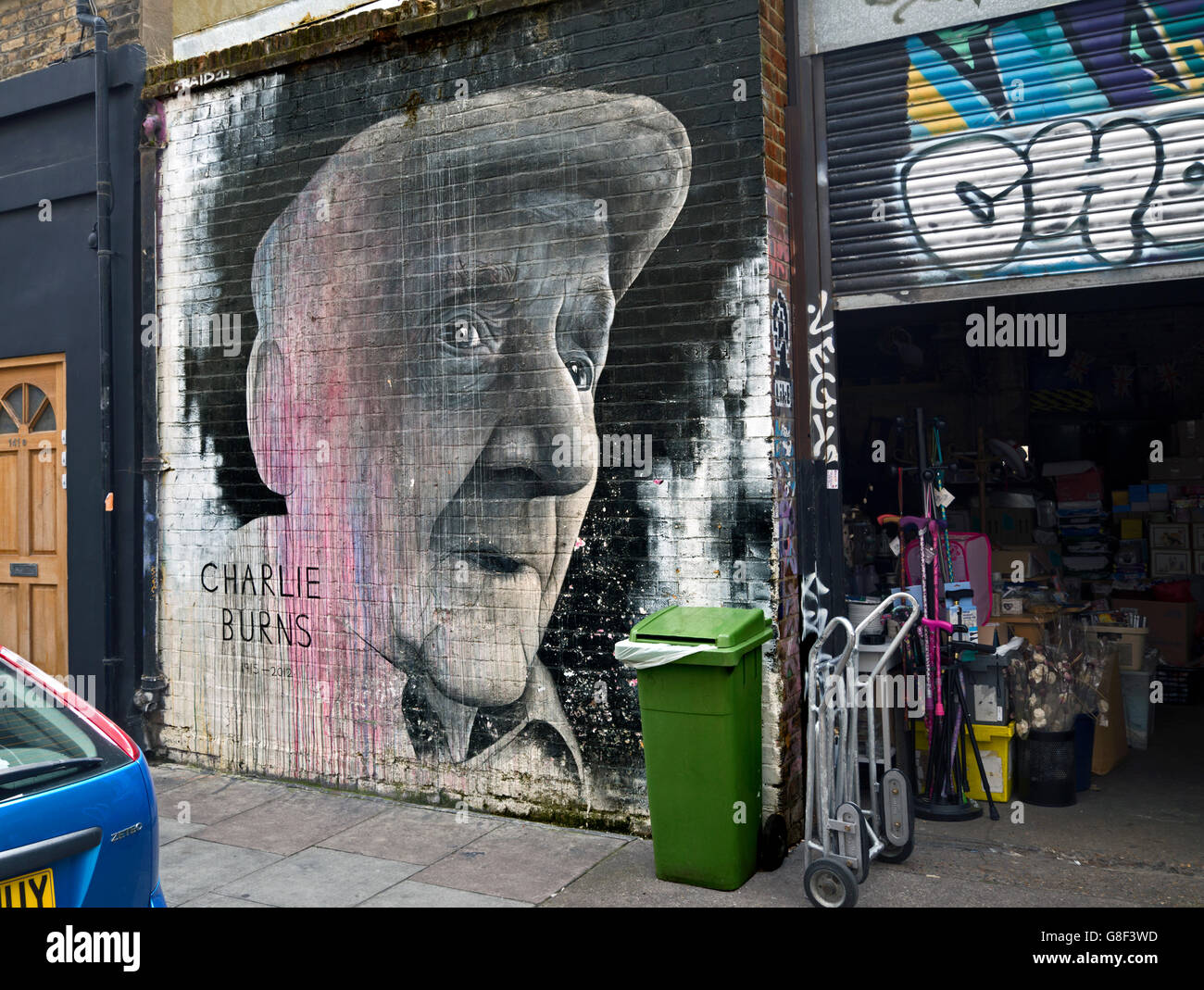 Portrait of Charlie Burns by street artist Ben Slow on a wall in Bacon ...