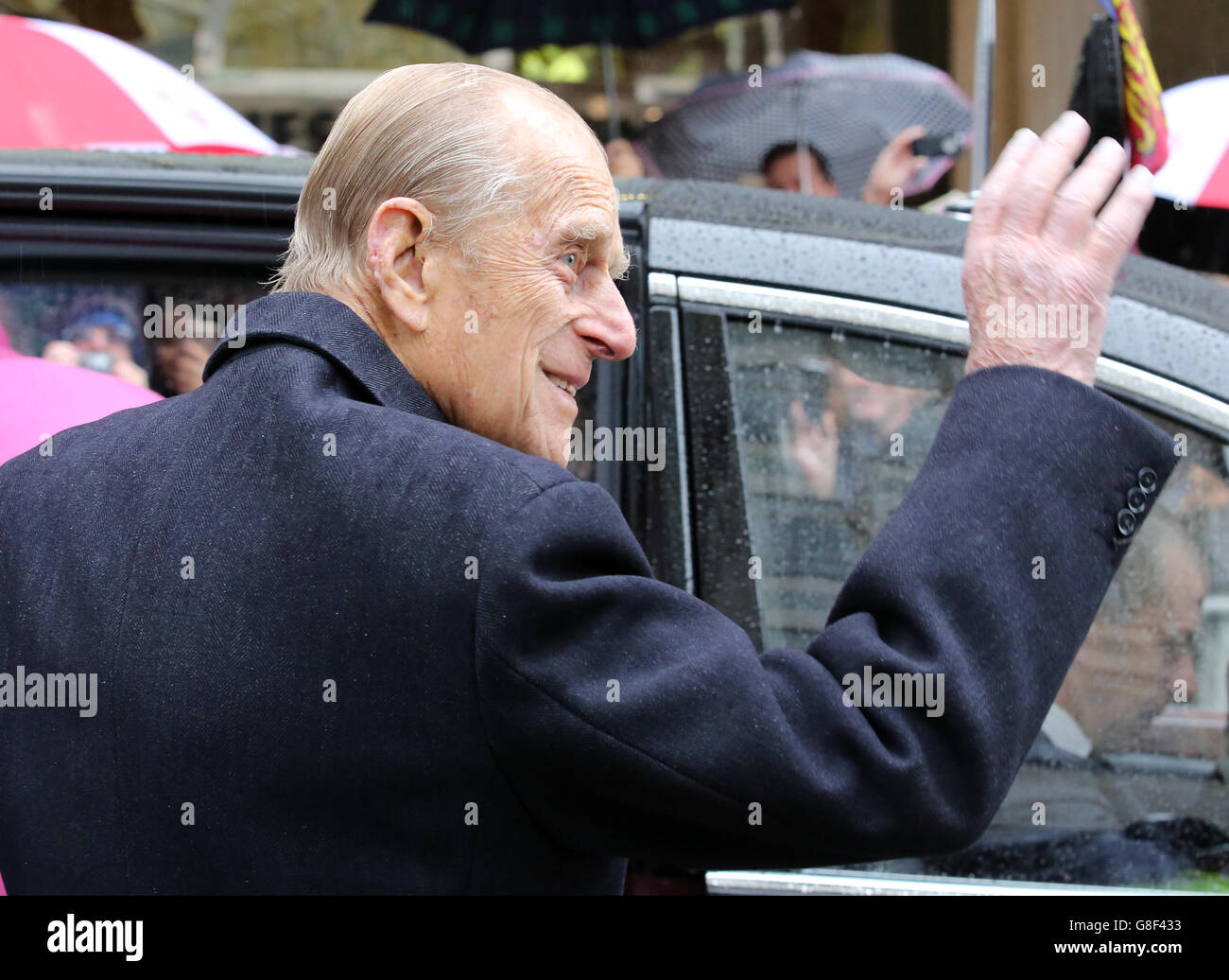 The Duke of Edinburgh waves during a visit to the Metroline Tramline ...