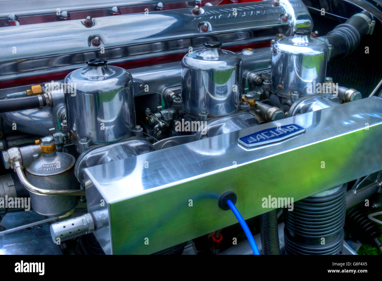 Close up of a Jaguar C Type engine with subtle oil painting effect ...