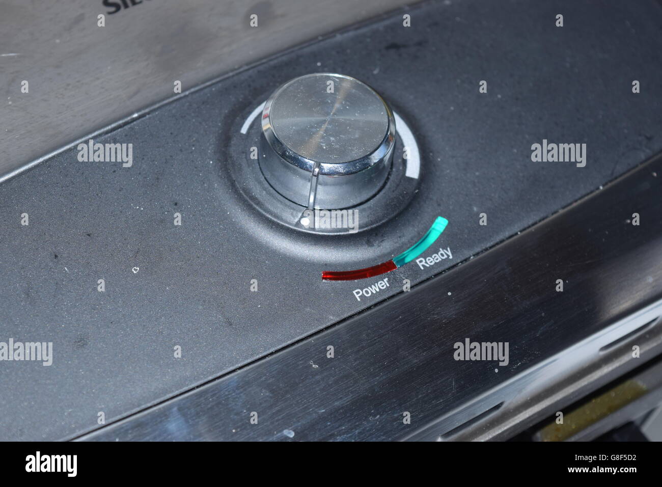 Close-up of an Electric Grill Button Stock Photo - Alamy