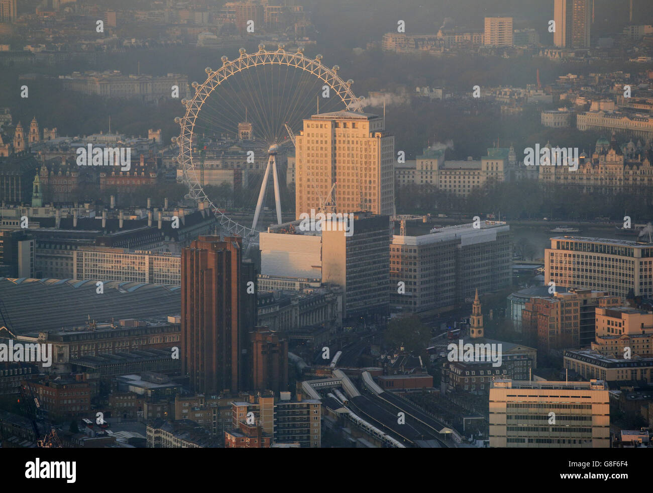 Morning sun strikes the London Eye and Shell Building as seen from the ...