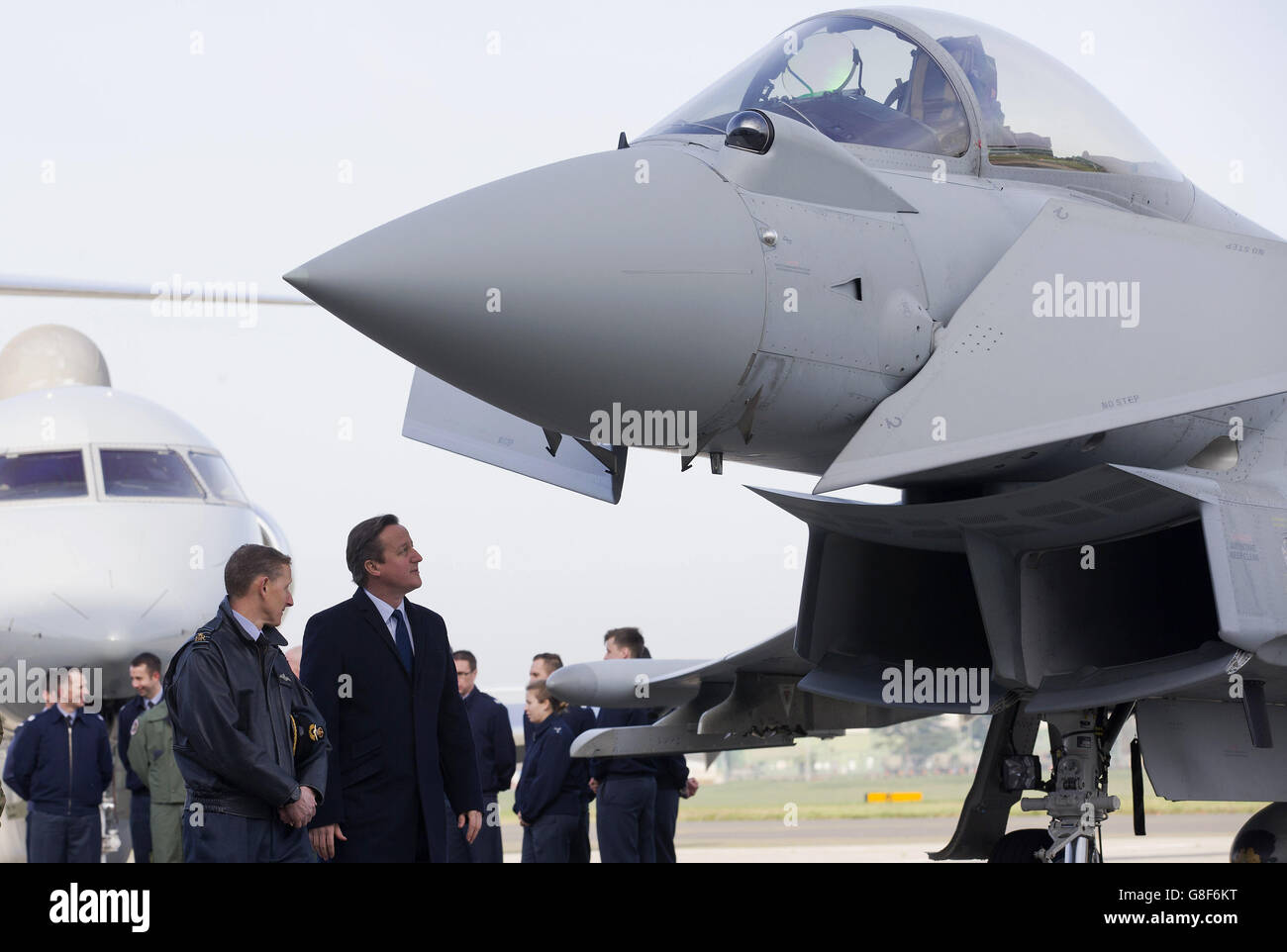Prime Minister David Cameron (right) looks at an RAF Eurofighter ...