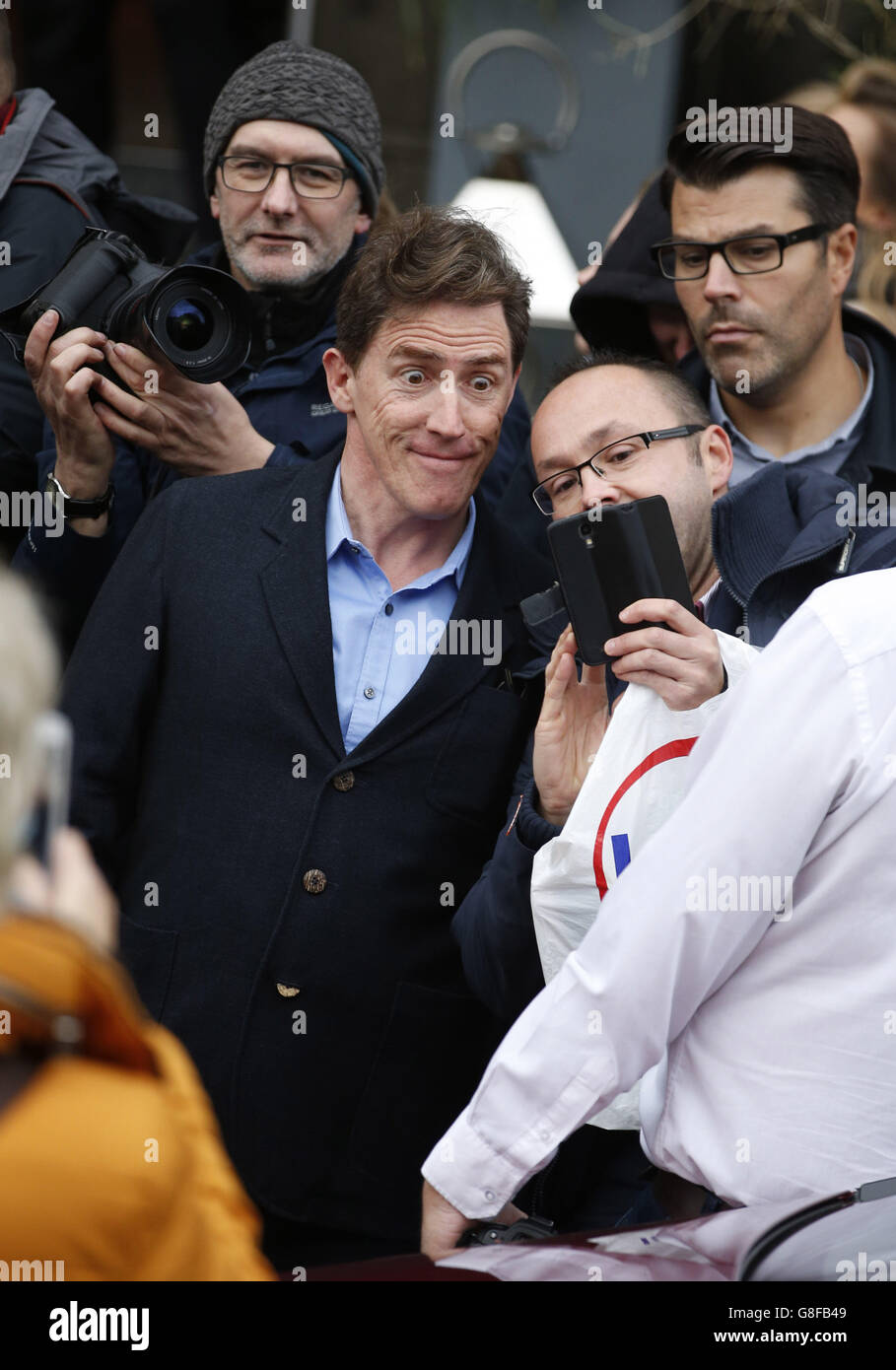 Comedian Rob Brydon (centre left) poses for a selfie outside the ...