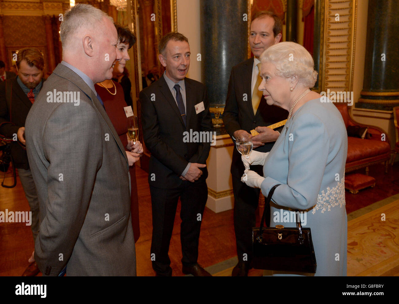 Queen Elizabeth II speaks with award winners during the annual Civil ...