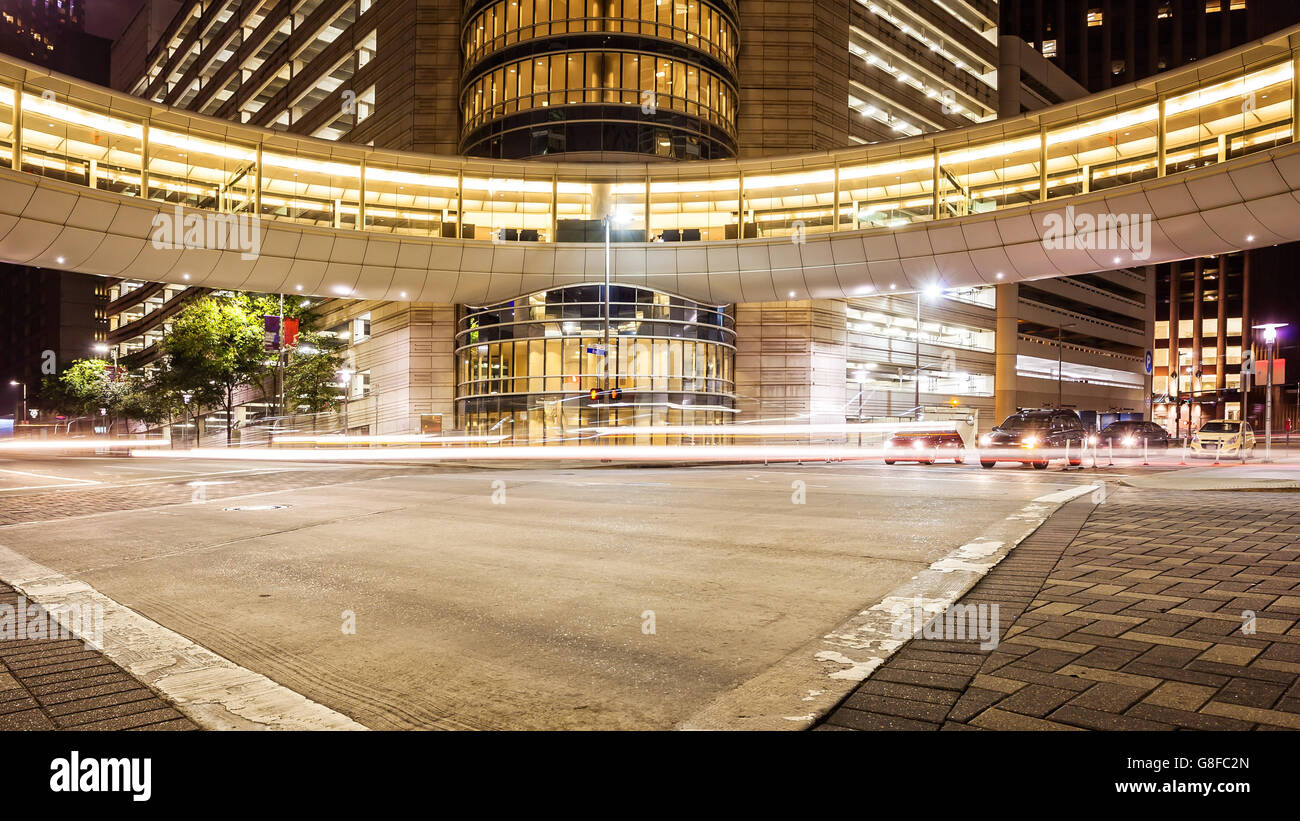 Busy intersection in downtown Houston, Texas at night with traffic ...