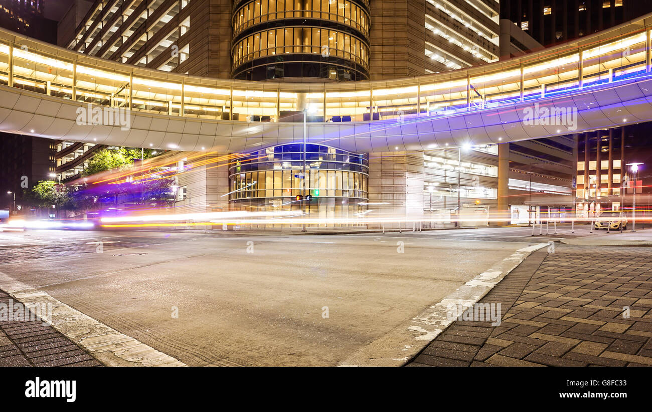 Busy intersection in downtown Houston, Texas at night with traffic ...