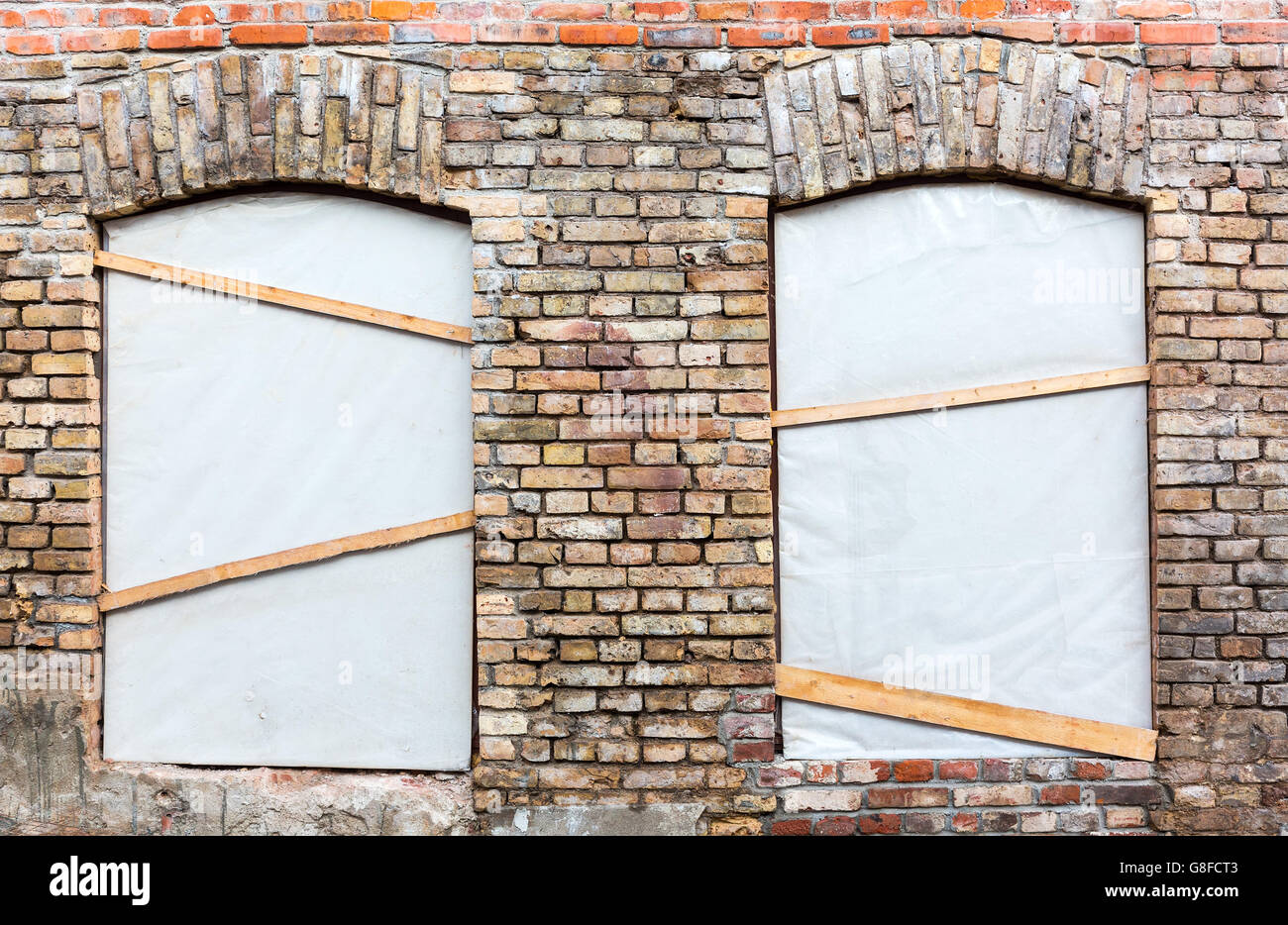 Closed windows on weathered brick wall - renovation Stock Photo - Alamy