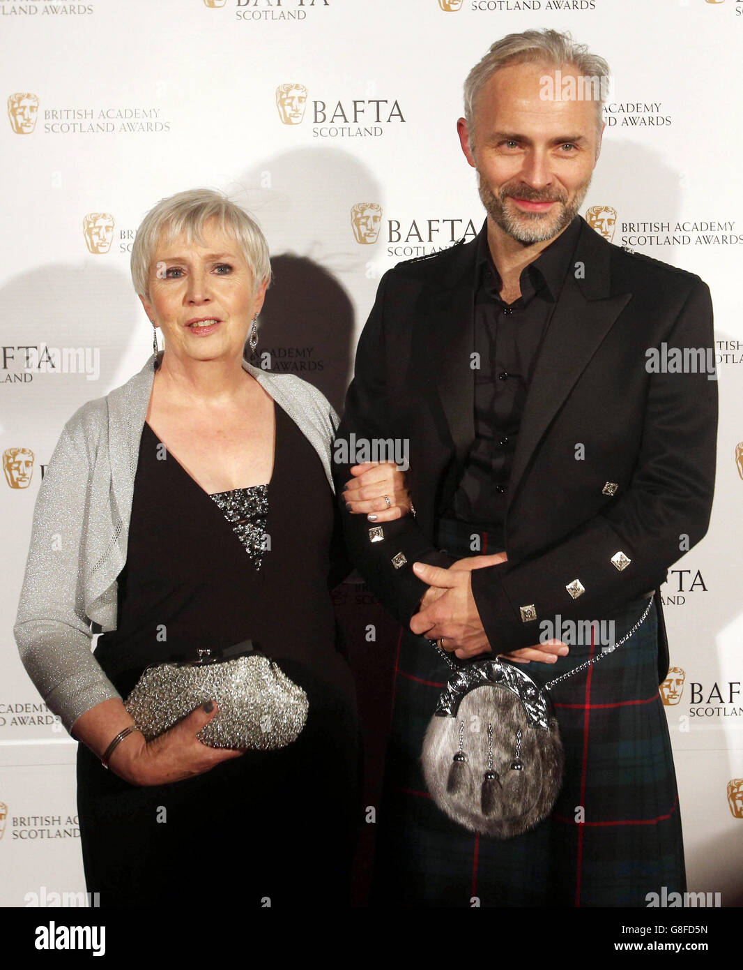 Mark Bonnar arriving with an unidentified woman at the British Academy ...