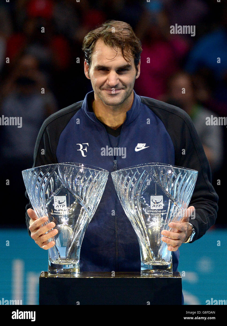 Switzerland's Roger Federer with the trophies for "Fans Favourite" and ...