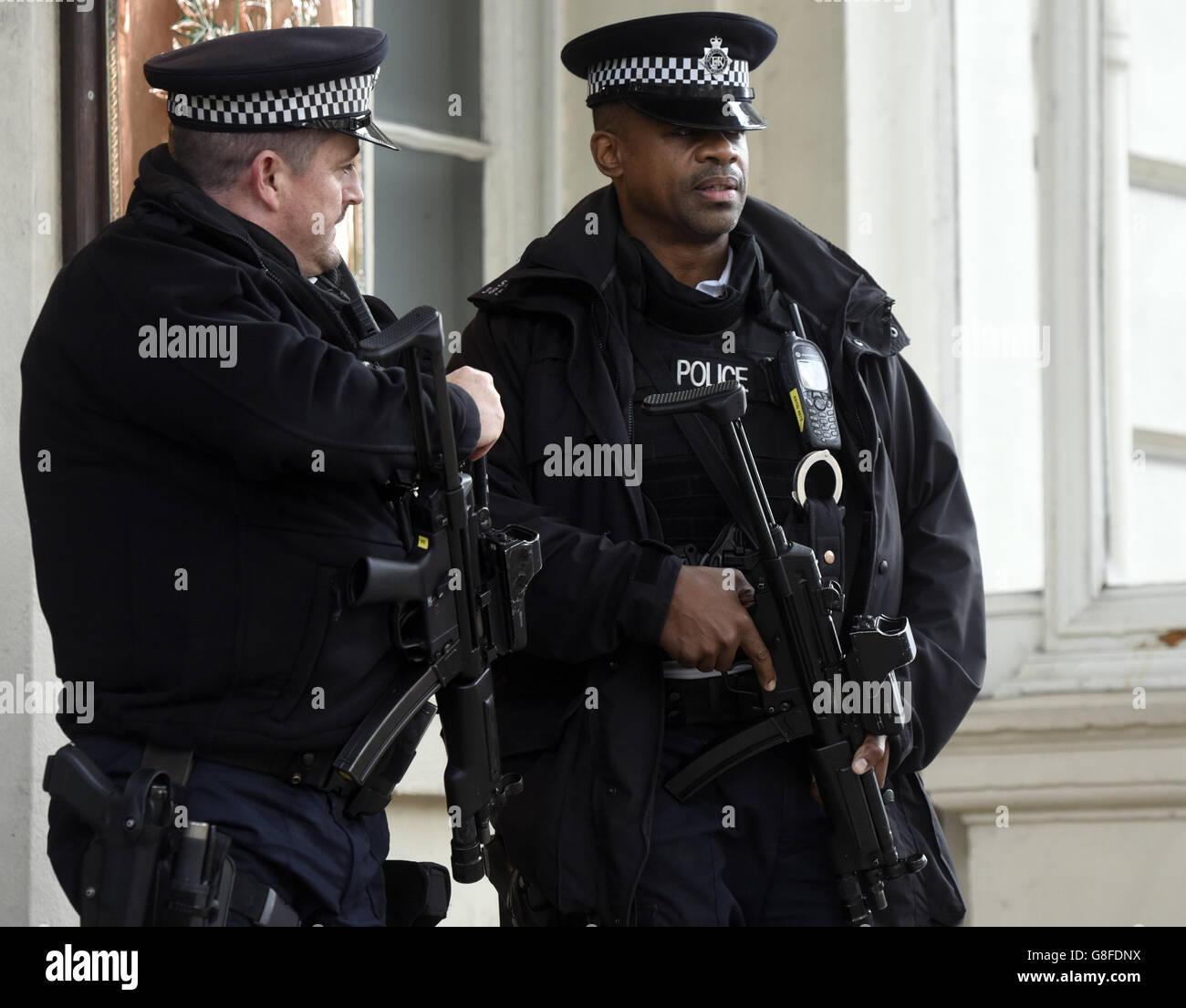 Armed police stand at the French Embassy in London after terror attacks ...