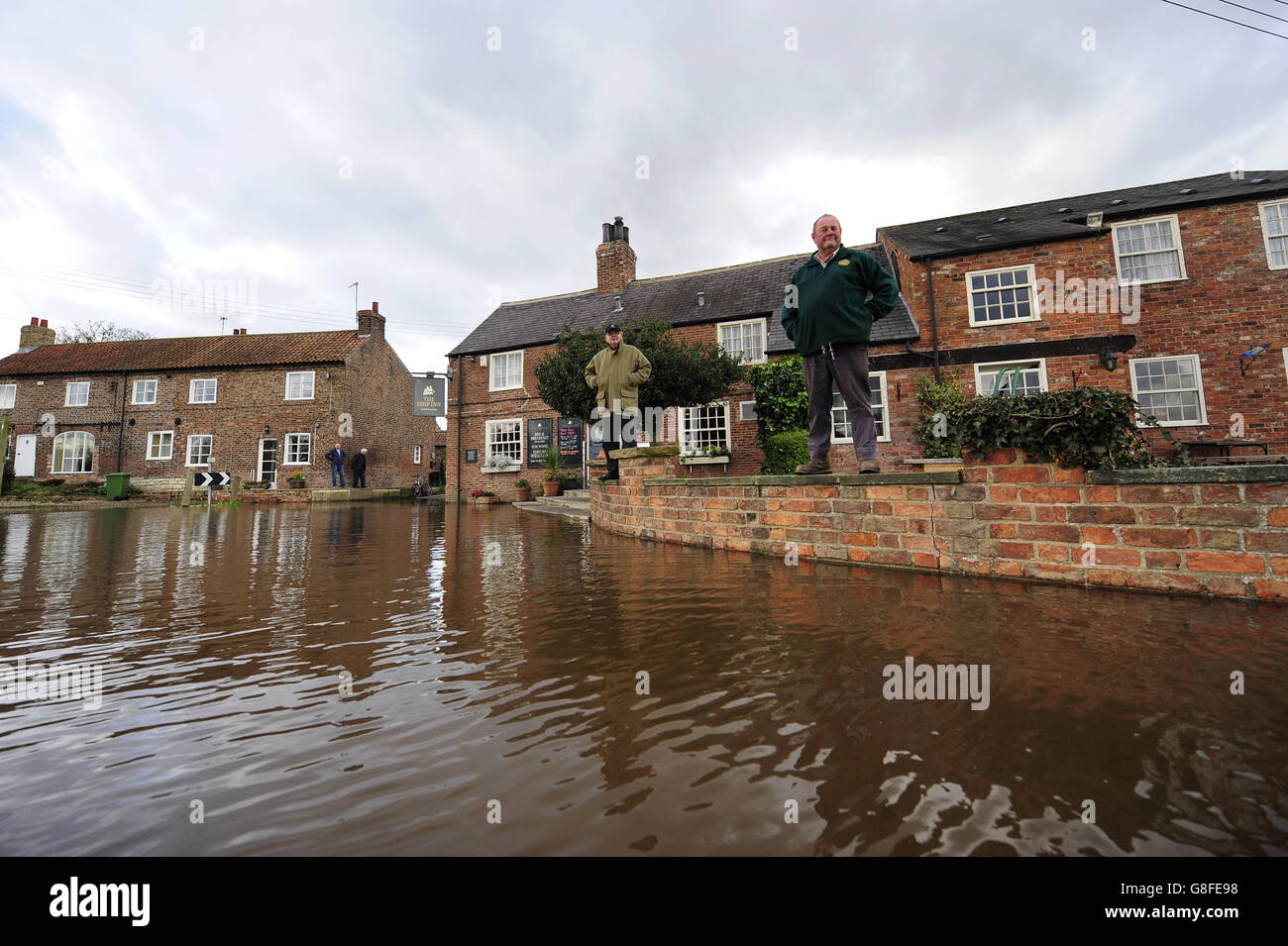Residents of Acaster Malbis in North Yorkshire watch rising floodwater ...