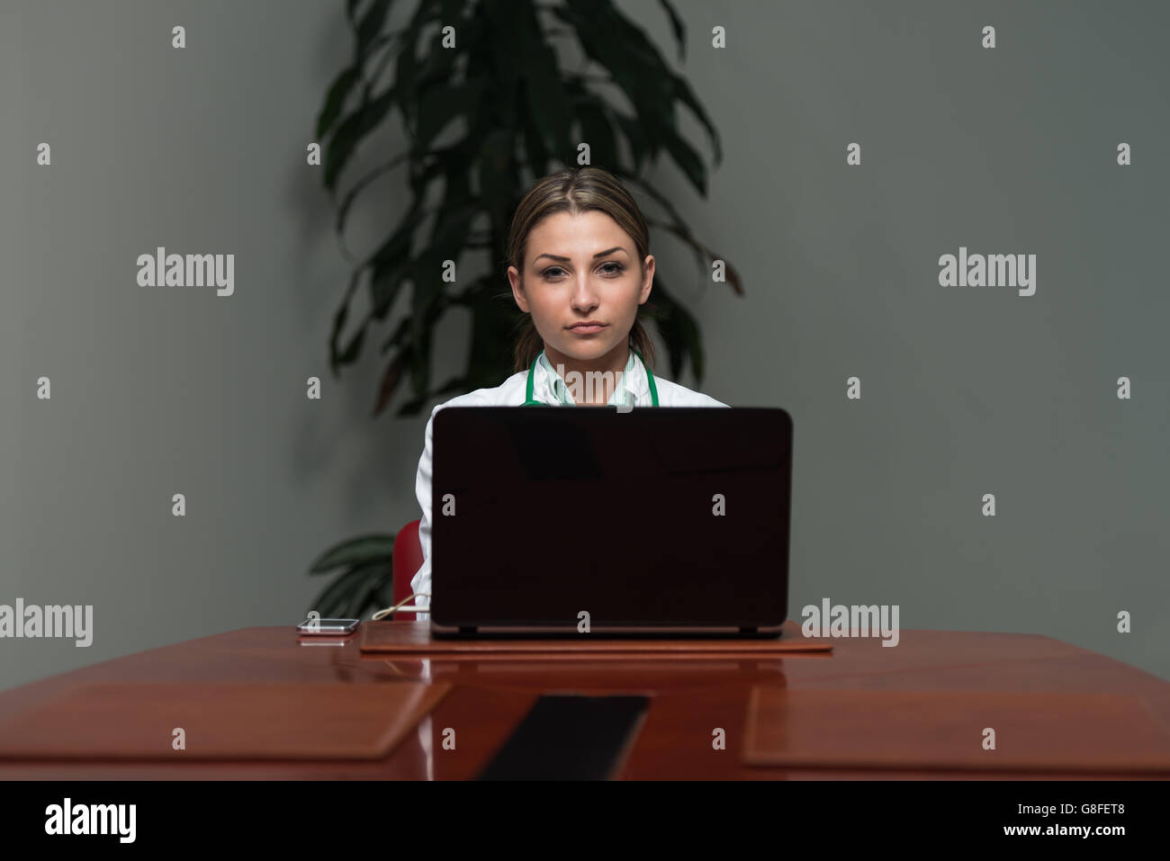 Young Pretty Female Doctor With Notebook In The Office - Successful ...