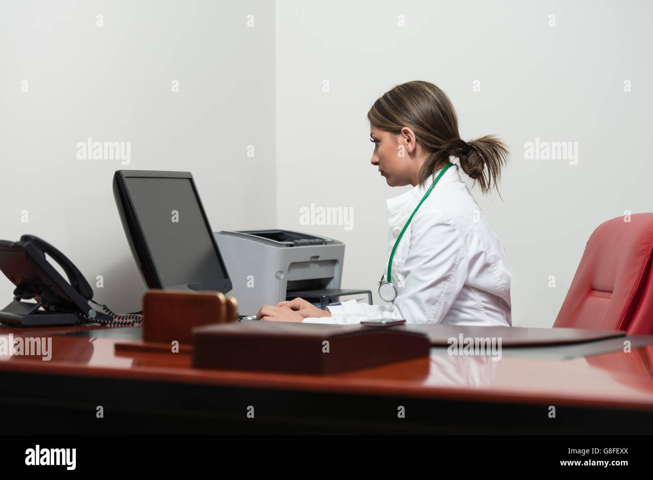 Young Pretty Female Doctor With Computer In The Office - Successful ...
