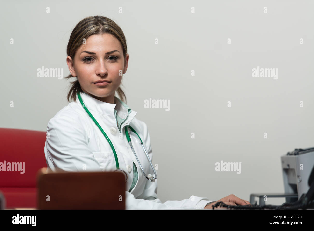 Young Pretty Female Doctor With Computer In The Office - Successful ...