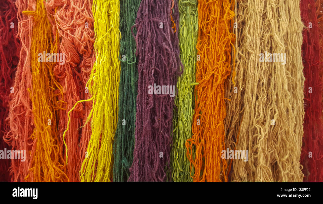 Hanks of various colors of dyed wool Stock Photo - Alamy