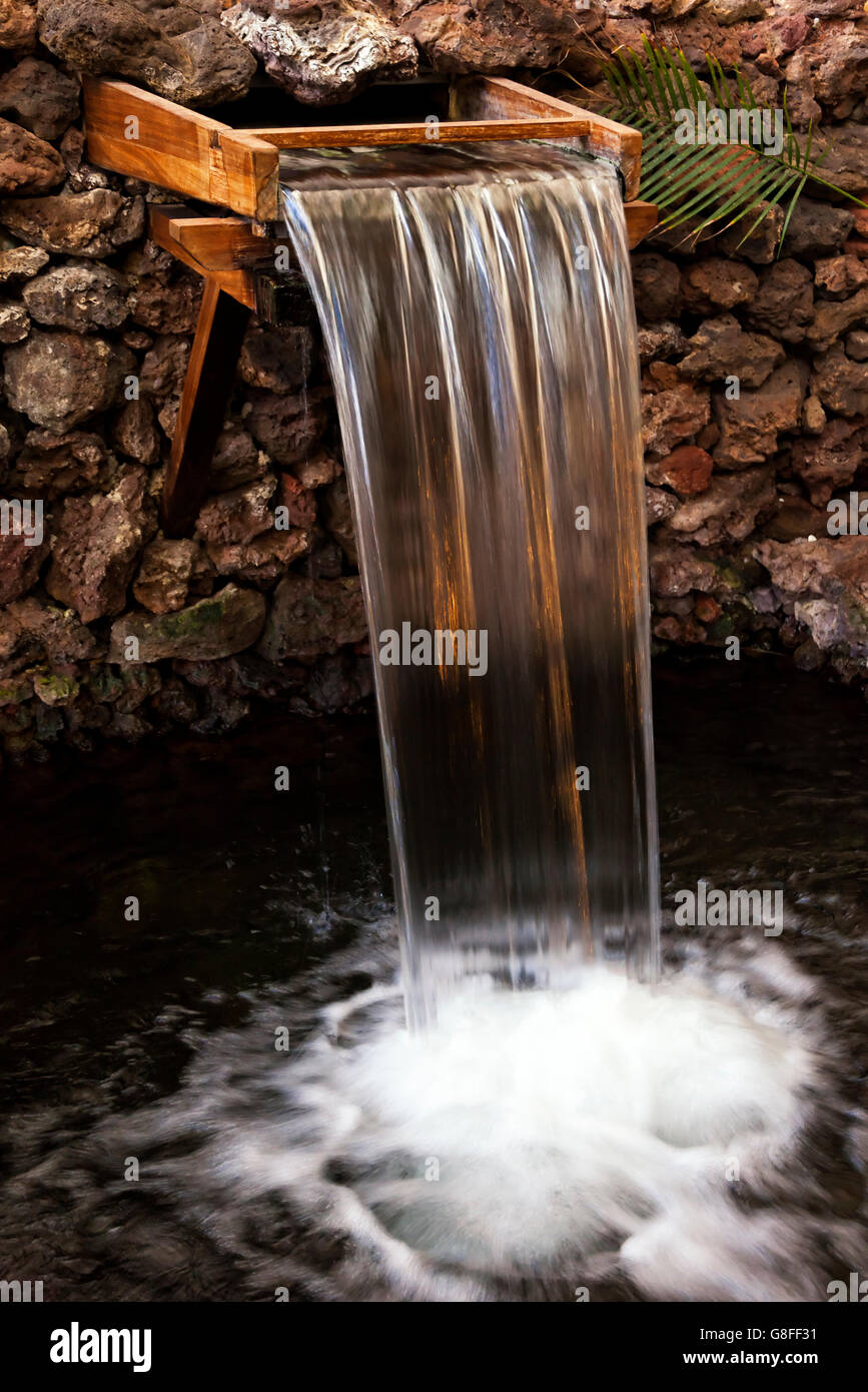 Traditional wooden fountain with flowing water Stock Photo - Alamy