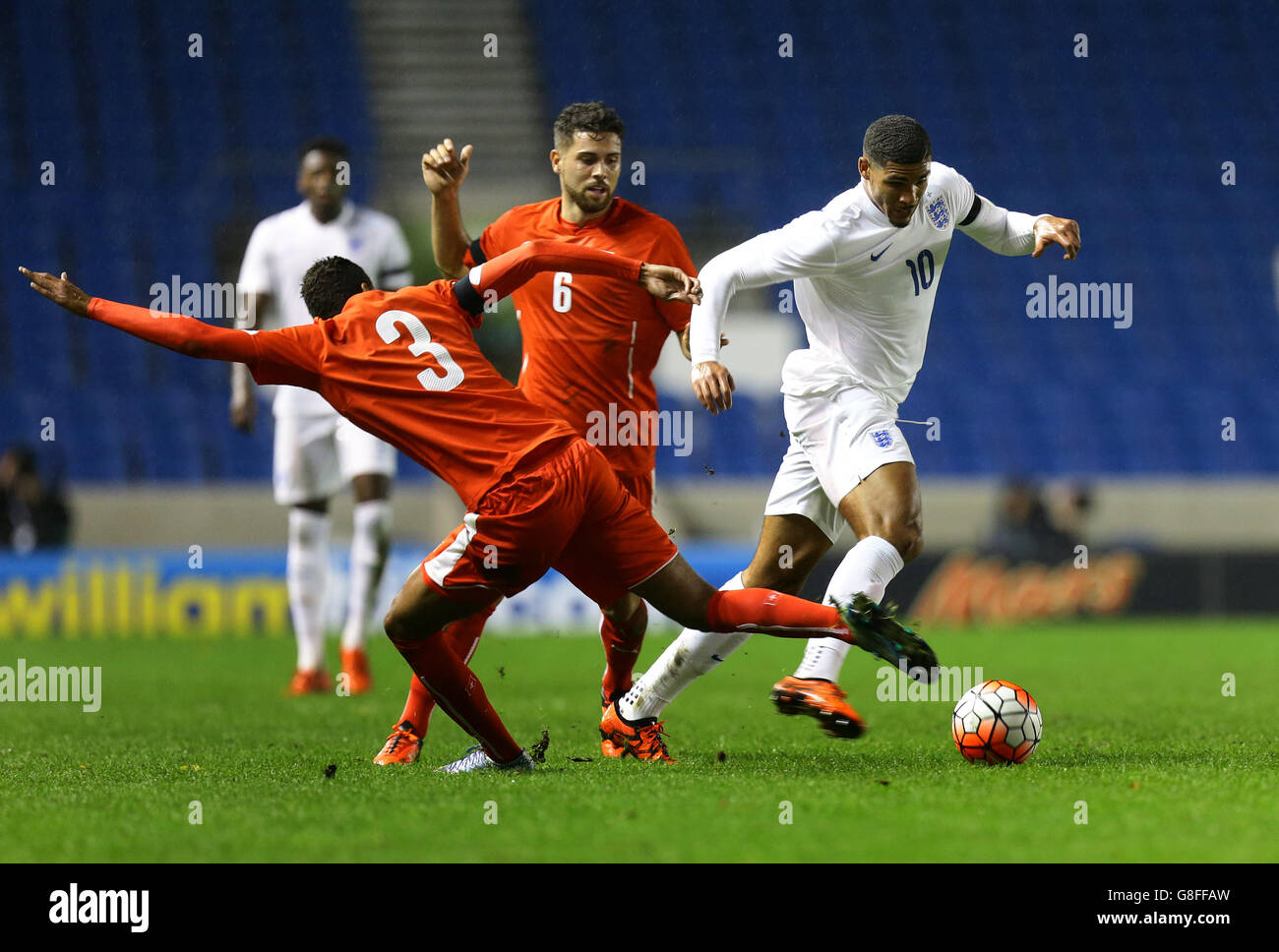 Switzerland's Martin Angha (left) challenges England's Ruben Loftus ...