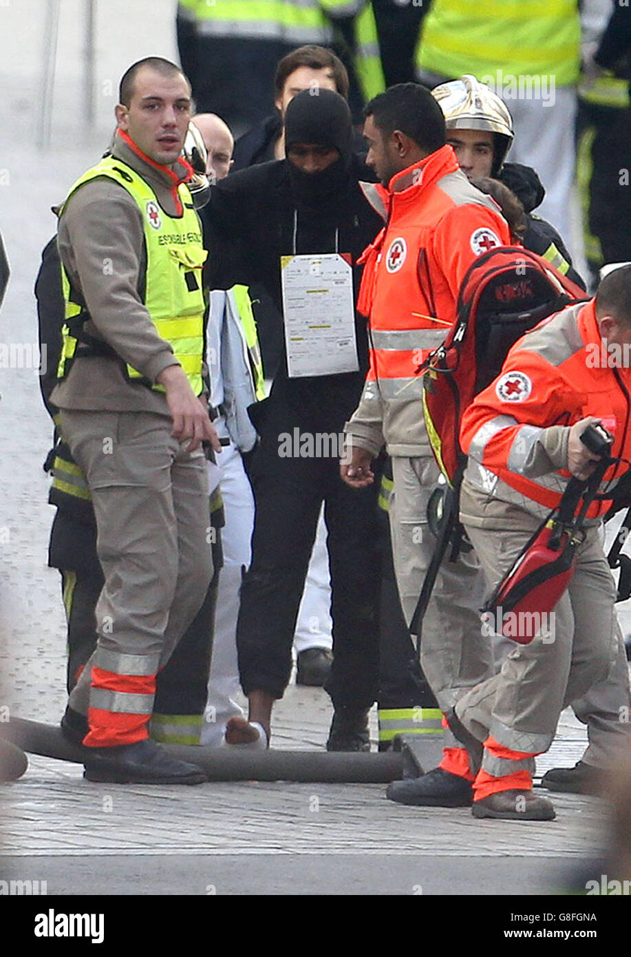 A wounded police officer during a raid on an apartment in the Saint ...
