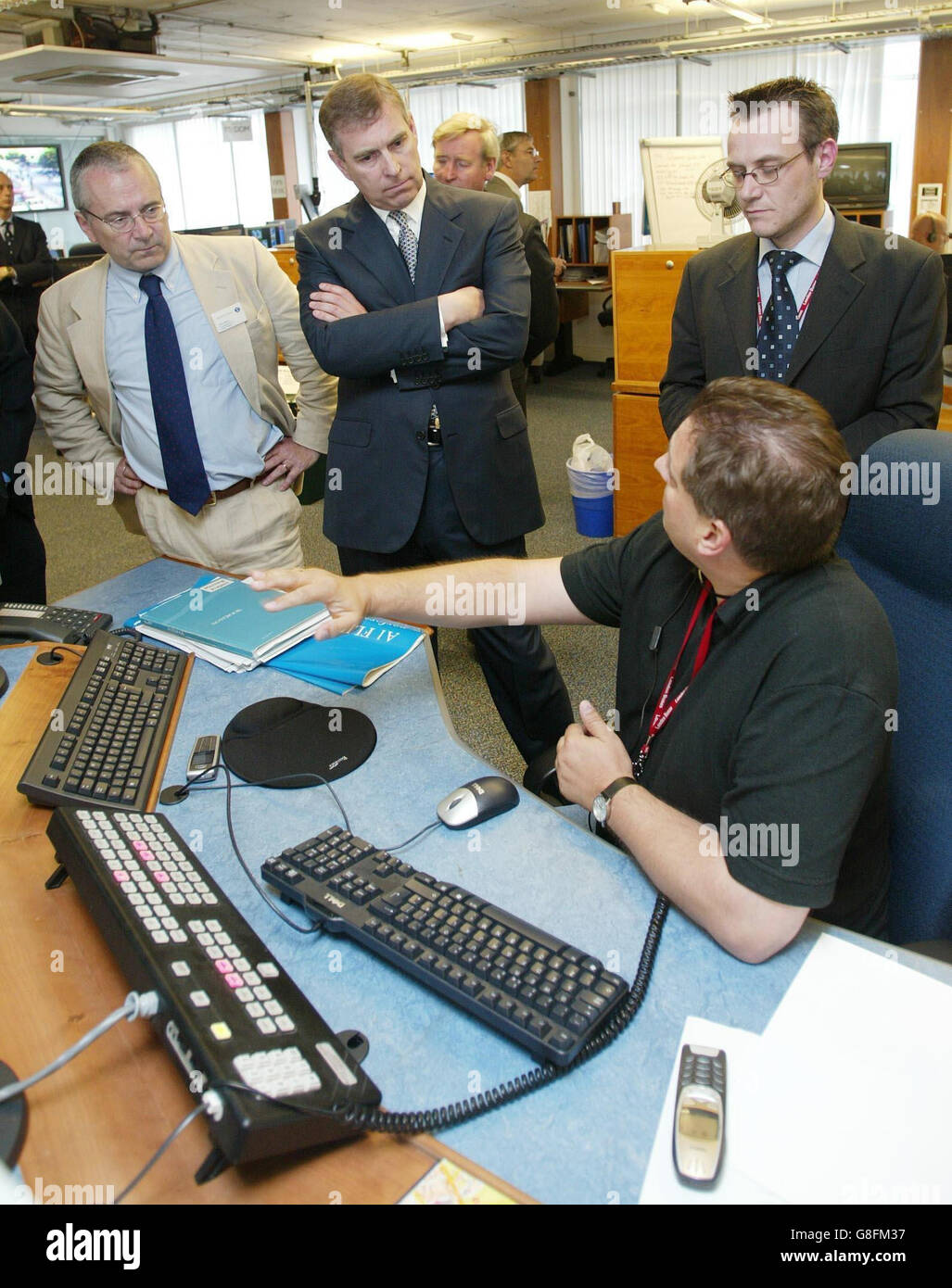The Duke of York (second left) speaks to Alan Dell (sitting), network ...
