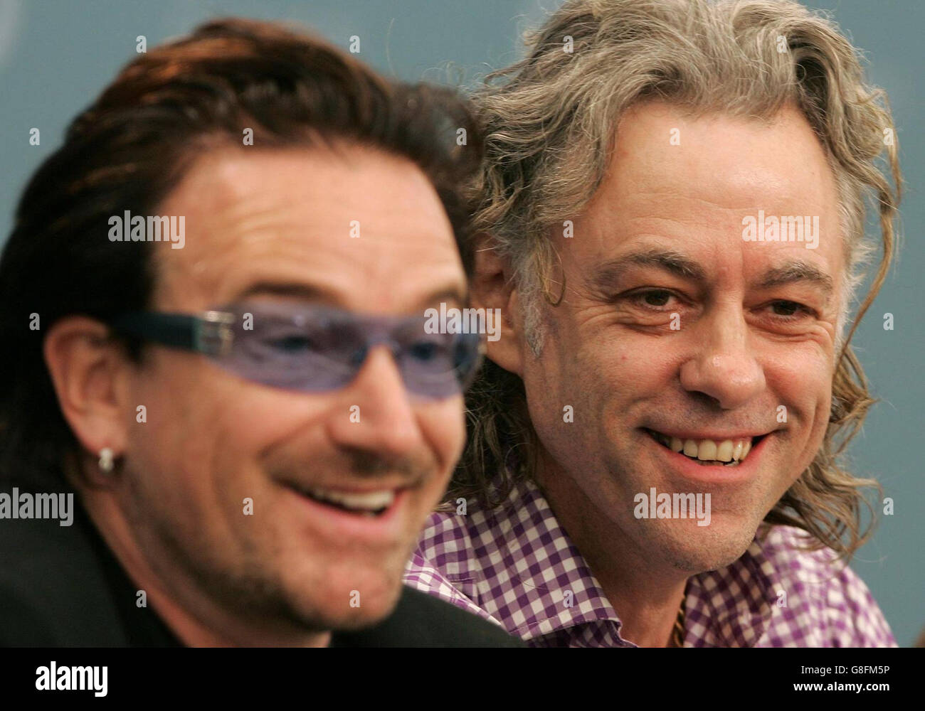 Pop stars and anti poverty campaigners Bob Geldof (R) and Bono share a ...