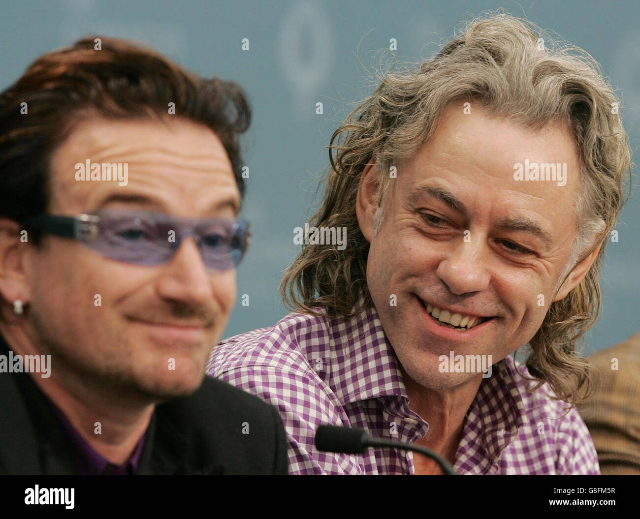 Pop stars and anti poverty campaigners Bob Geldof (L) and Bono share a ...