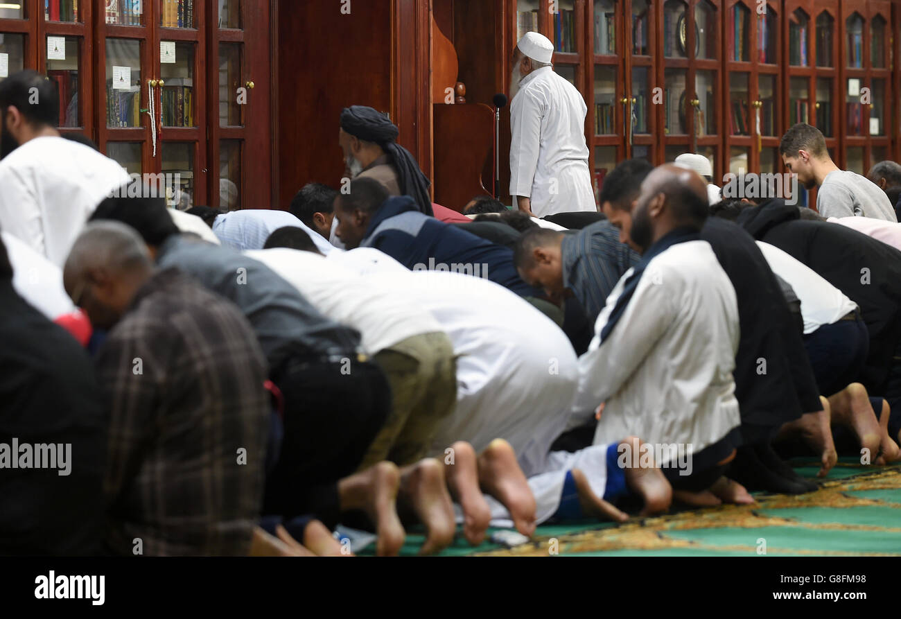 Muslim men pray before breaking their fast after sunset during the holy month of Ramadan at ...
