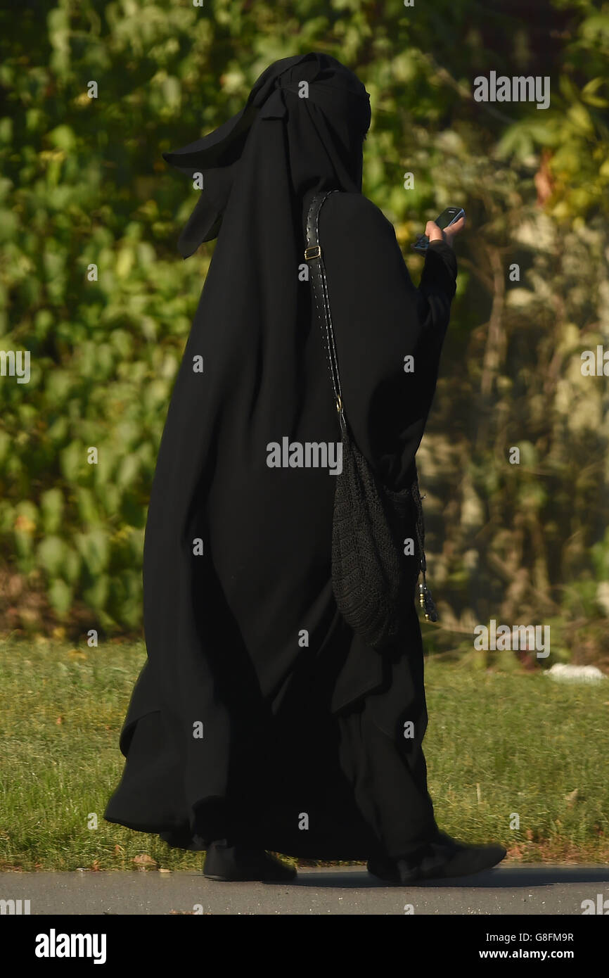 Muslim woman wearing burka walks through small heath in birmingham hi ...
