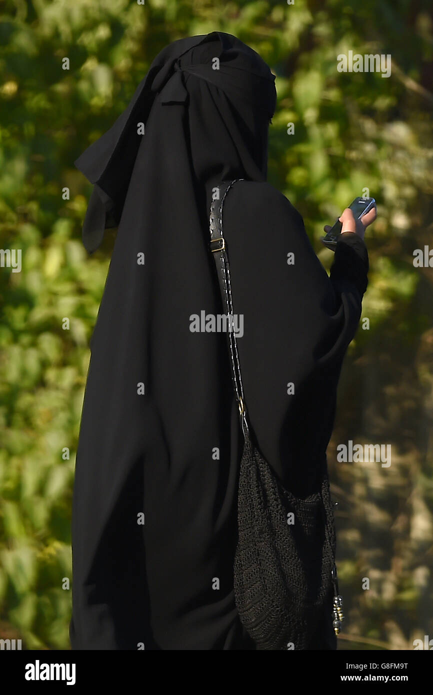 Burka stock. A Muslim woman wearing a burka walks through Small Heath ...