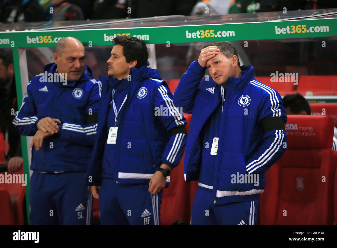 Chelsea first team coach Steve Holland (right) appears dejected on the ...