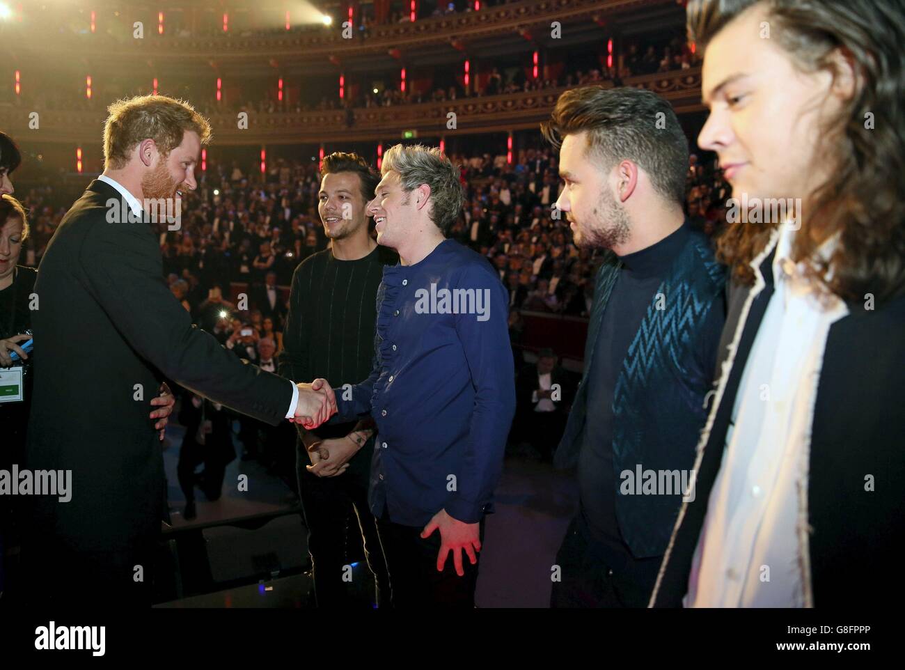 Prince Harry greets members of One Direction after the Royal Variety ...