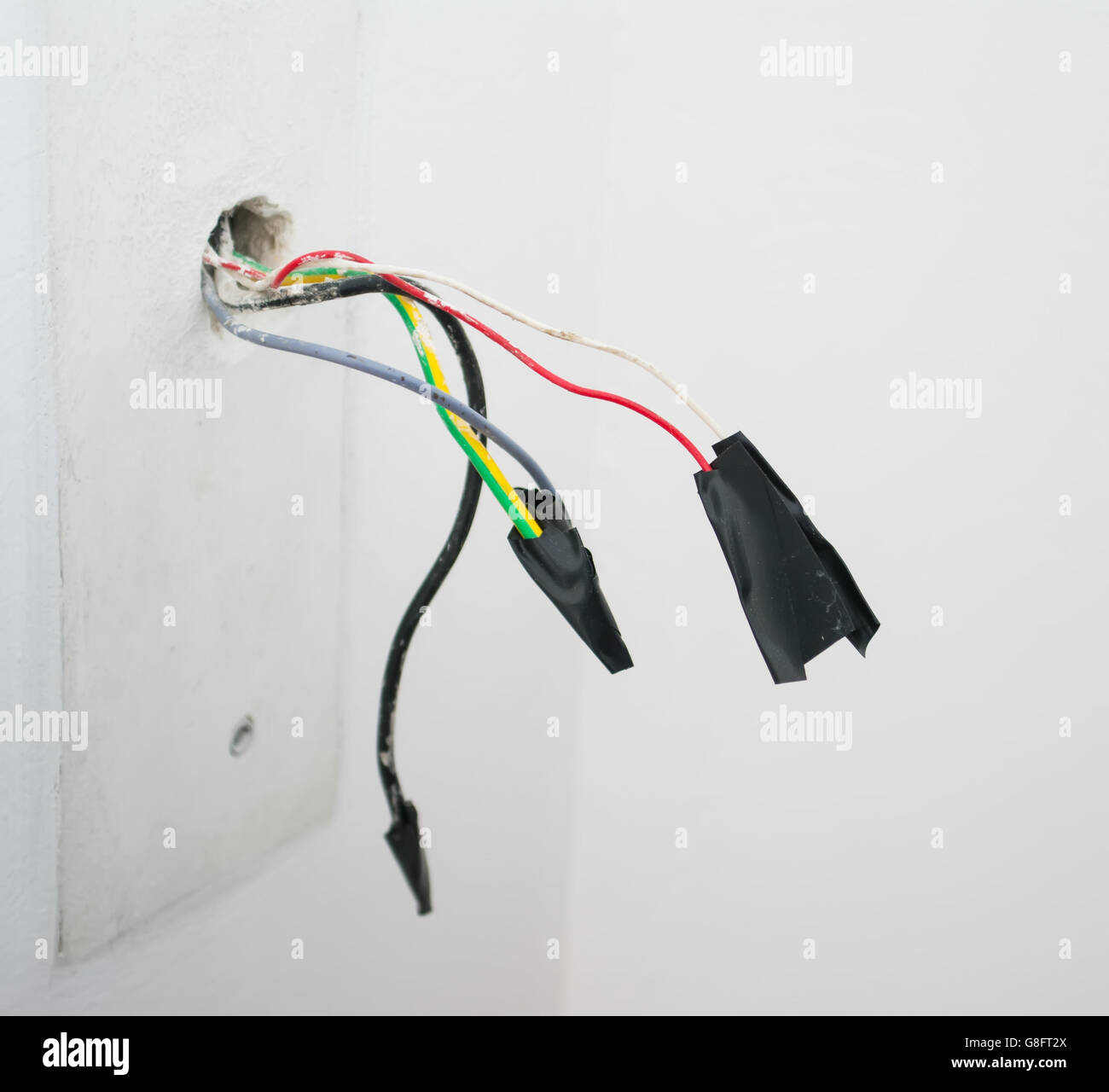 Electrical wires hanging wall hi-res stock photography and images - Alamy