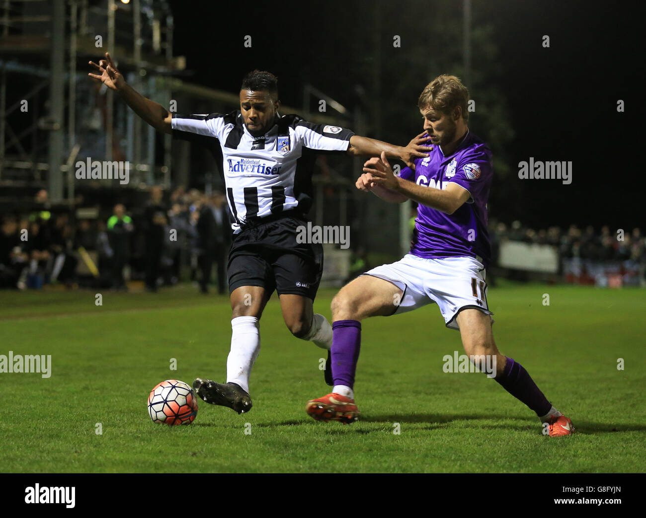 Maidenhead United's Ryan Peters (left) and Port Vale's Sam Foley battle ...