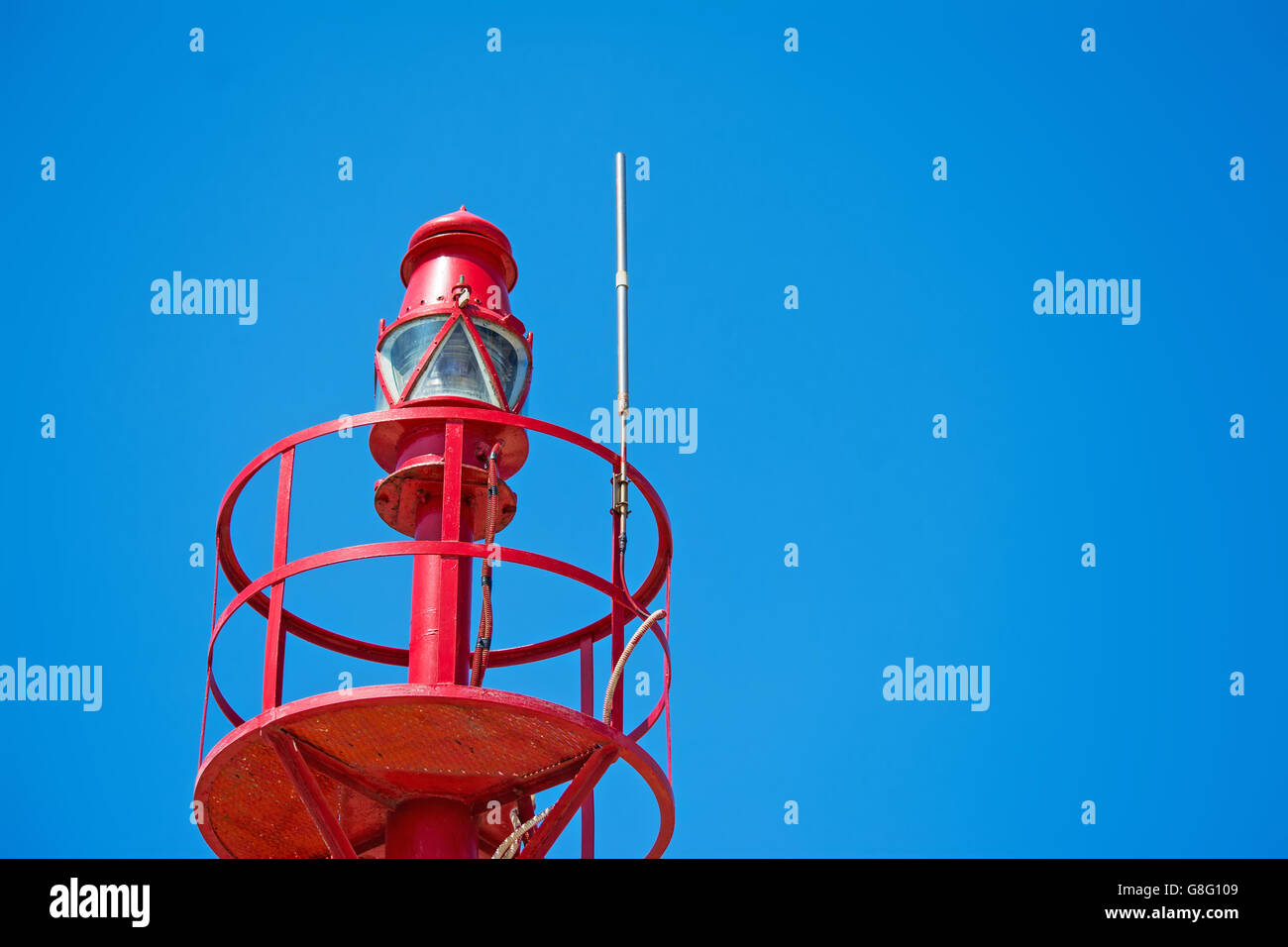 red lighthouse under a blue sky Stock Photo - Alamy