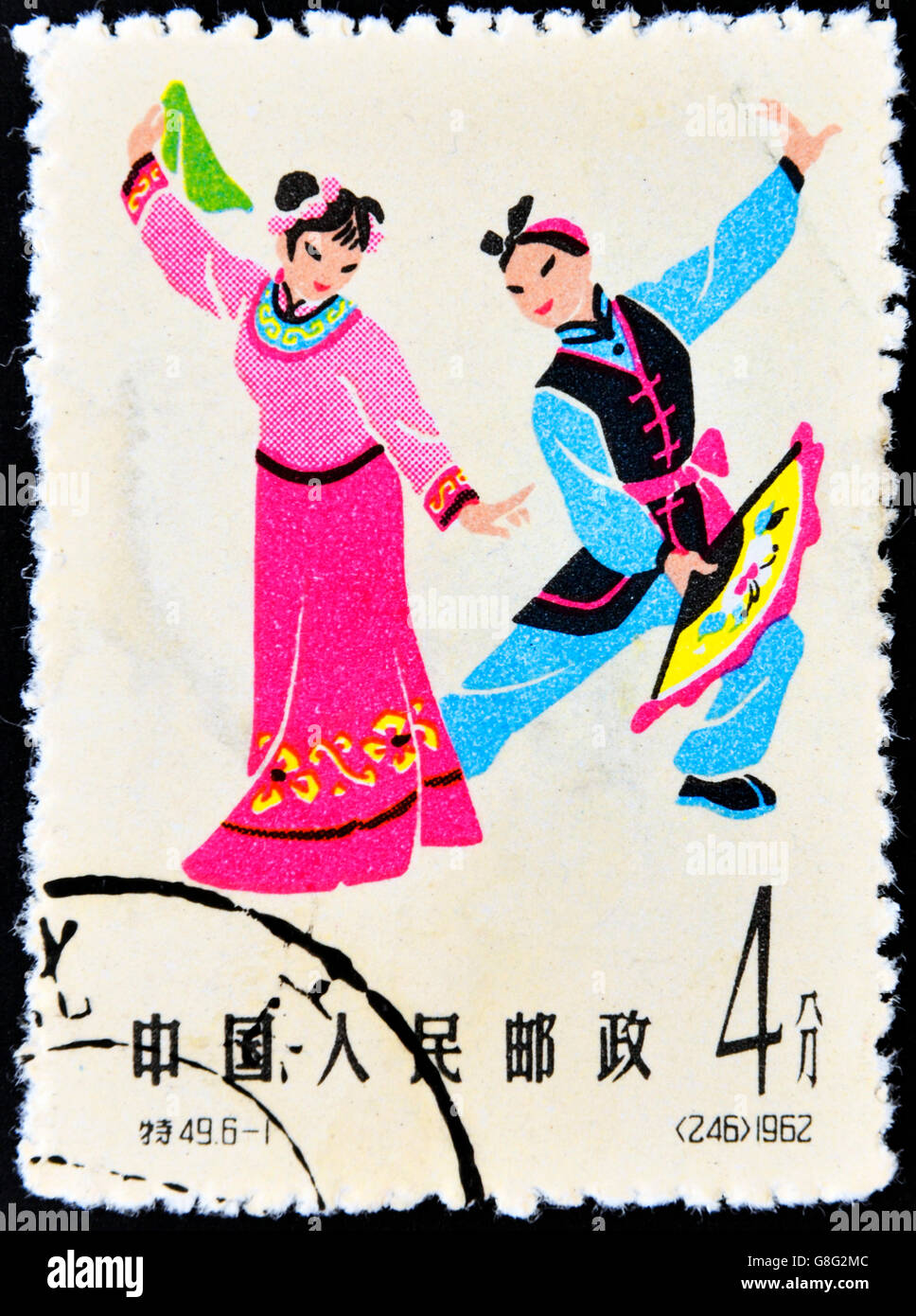 CHINA- CIRCA 1962. A stamp printed in China depicting traditional wear ...