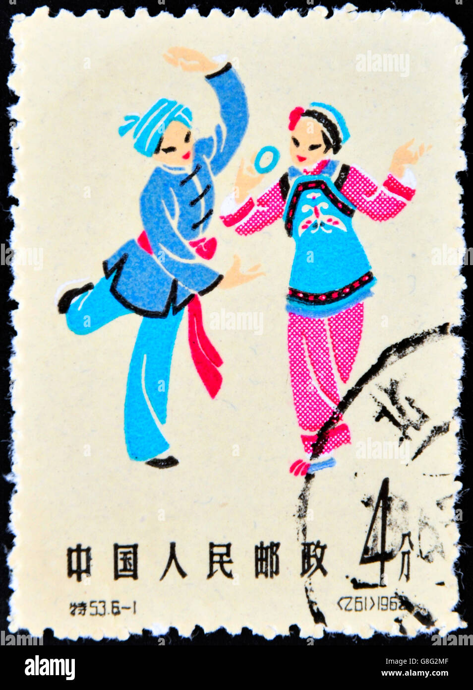 CHINA- CIRCA 1962. A stamp printed in China depicting traditional wear ...