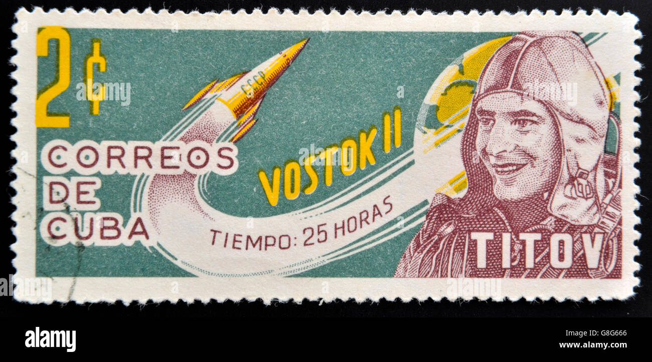 CUBA - CIRCA 1963: A stamp printed in Cuba shows Titov and rocket ...