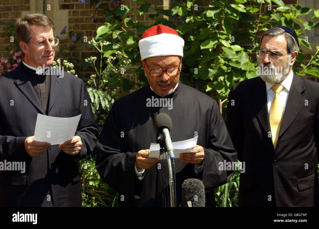 Chair of the Council of Mosques & Imams, Sheikh Dr Zaki Badawi, flanked ...