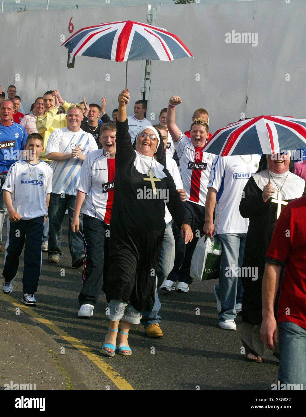 Loyalist supporters celebrate after being allowed to walk down the ...