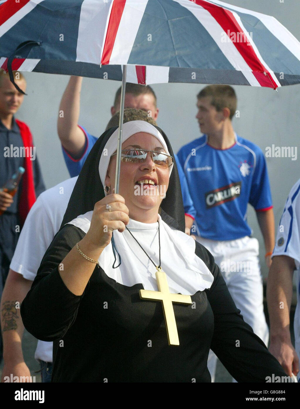 Loyalist supporters celebrate after being allowed to walk down the ...