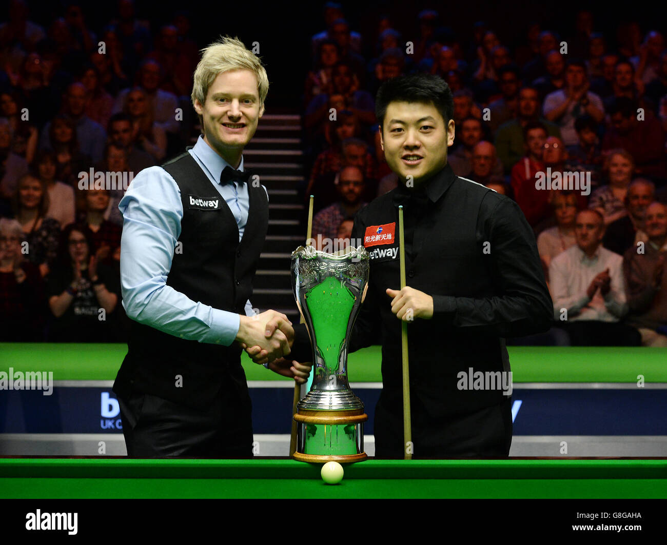 Neil Robertson (left) and Liang Wenbo shake hands before the start of ...