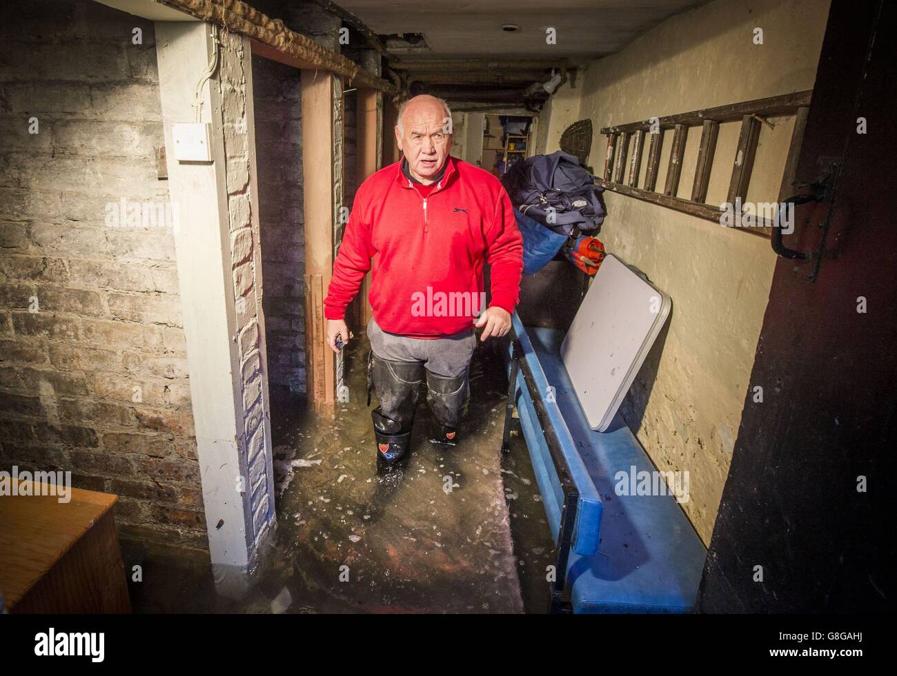 Jim Renwick walks through his flooded cellar in Hawick, Scotland, after ...